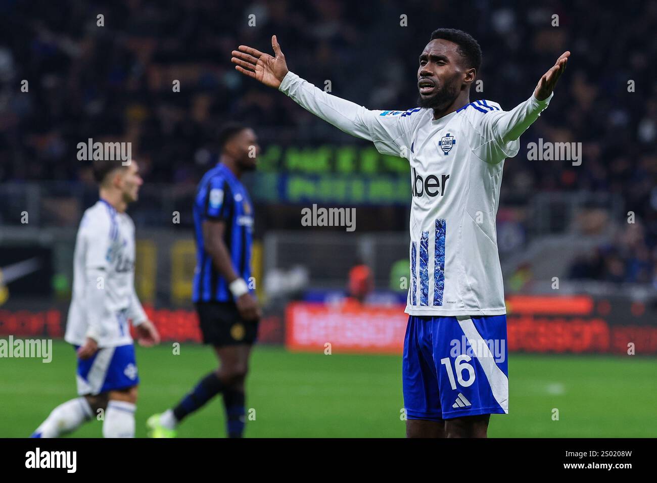 Milan, Italy. 23rd Dec, 2024. Alieu Fadera of Como 1907 reacts during ...