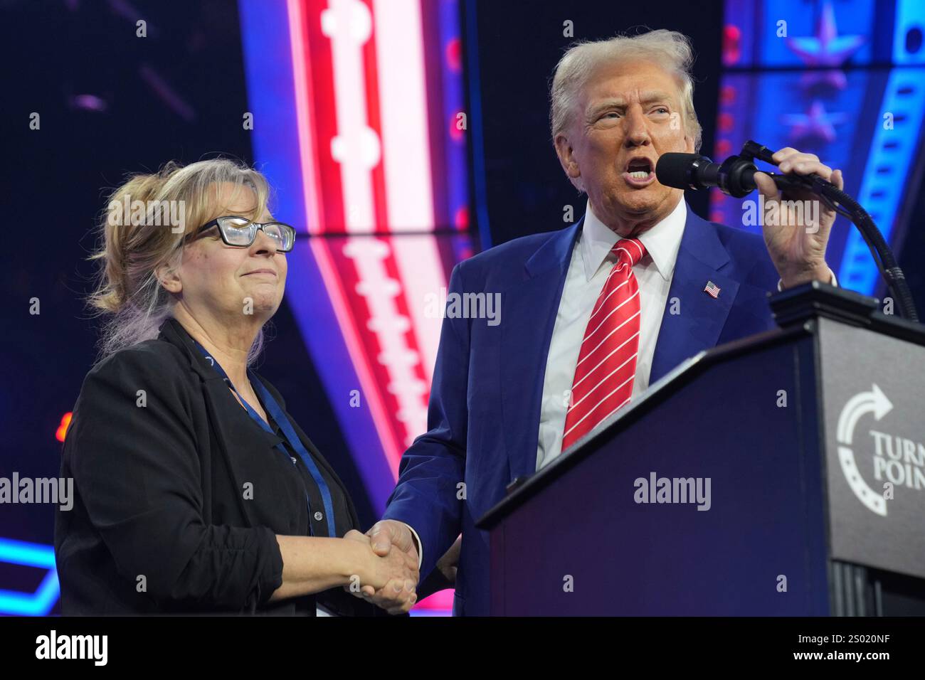 President-elect Donald Trump speaks with Patty Morin at AmericaFest ...