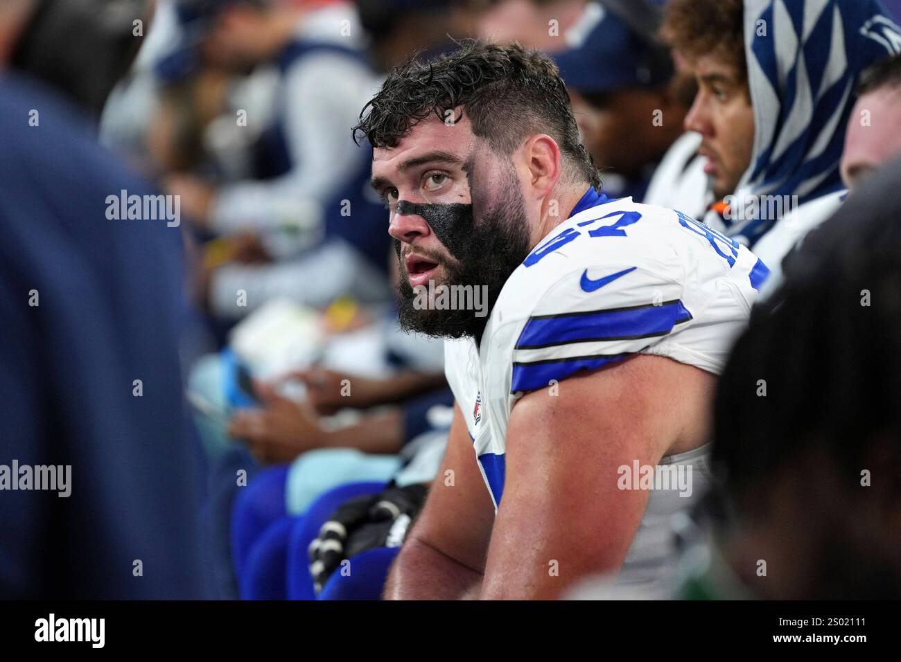 Dallas Cowboys center Brock Hoffman sits on the bench during the first ...