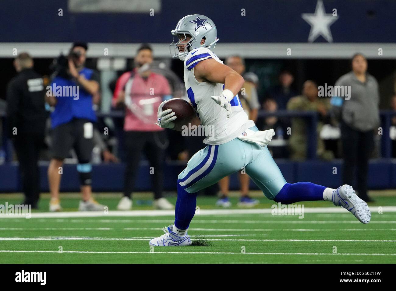 Dallas Cowboys tight end Jake Ferguson carries the ball on a reception ...