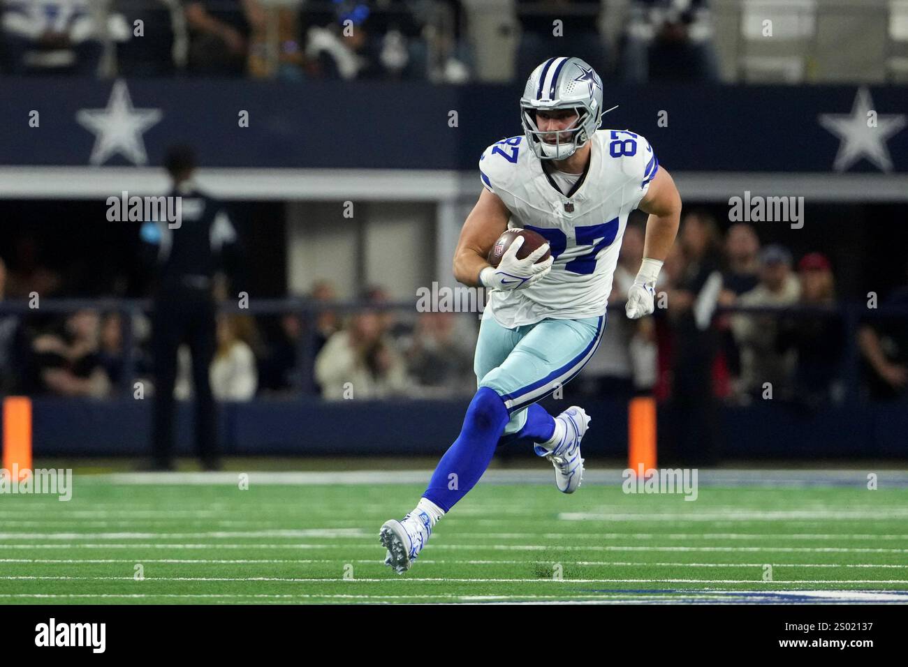 Dallas Cowboys tight end Jake Ferguson carries the ball upfield on a ...