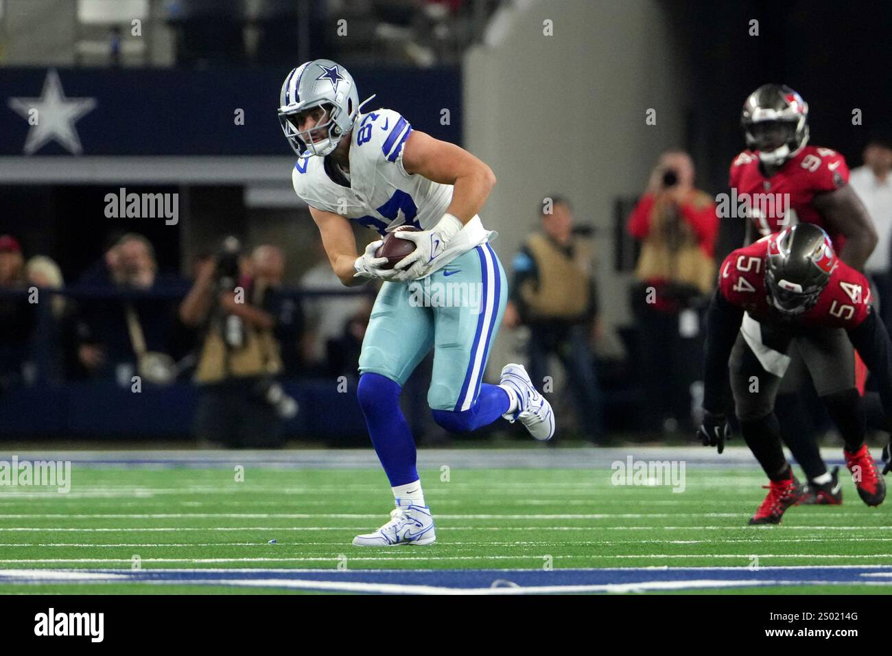Dallas Cowboys tight end Jake Ferguson carries the ball upfield on a ...