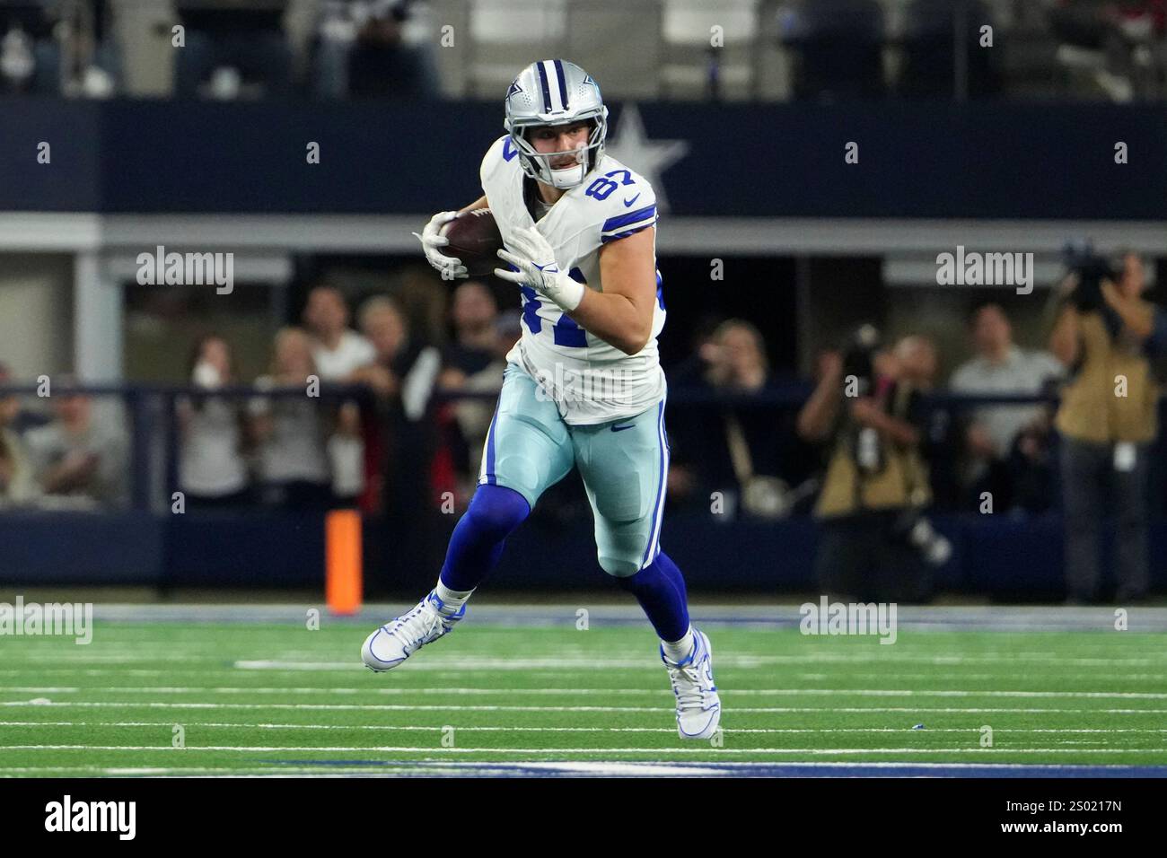 Dallas Cowboys tight end Jake Ferguson carries the ball upfield on a ...