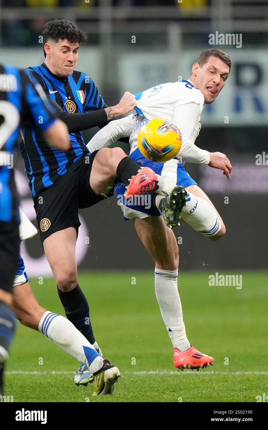 Inter Milan's Alessandro Bastoni, left, and Como's Andrea Belotti fight ...