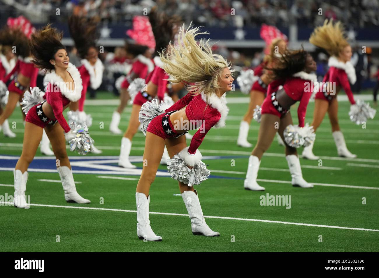 The Dallas Cowboys Cheerleaders, dressed in holiday themed outfits ...