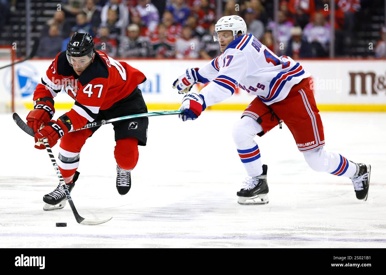 New Jersey Devils center Paul Cotter (47) plays the puck against New ...