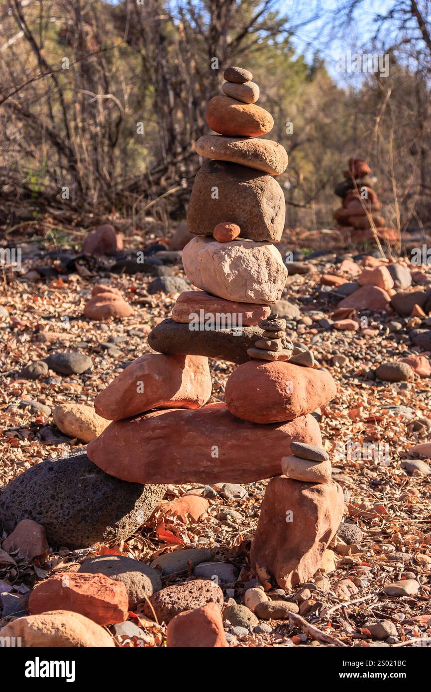 A stack of rocks is arranged in a pyramid shape. The rocks are of ...