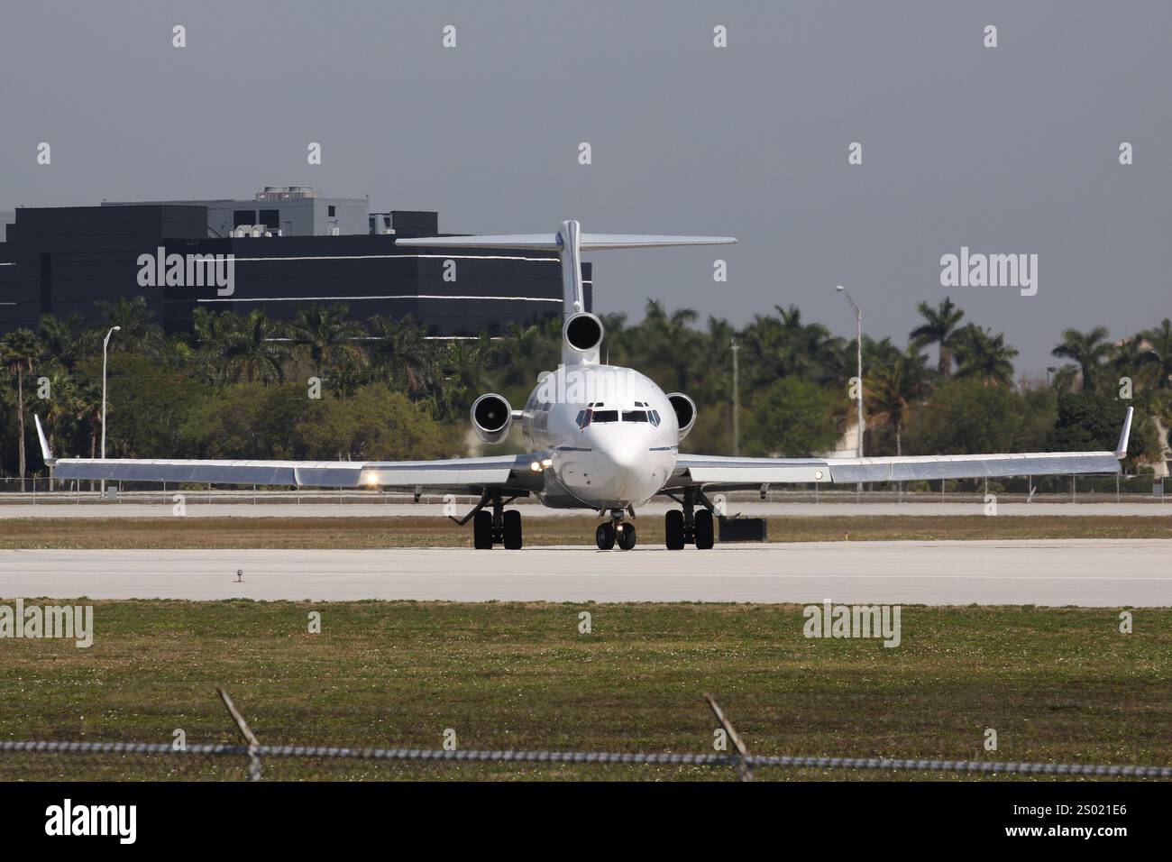 A classic cargo Boeing 727 lining up runway 9 at Miami International ...