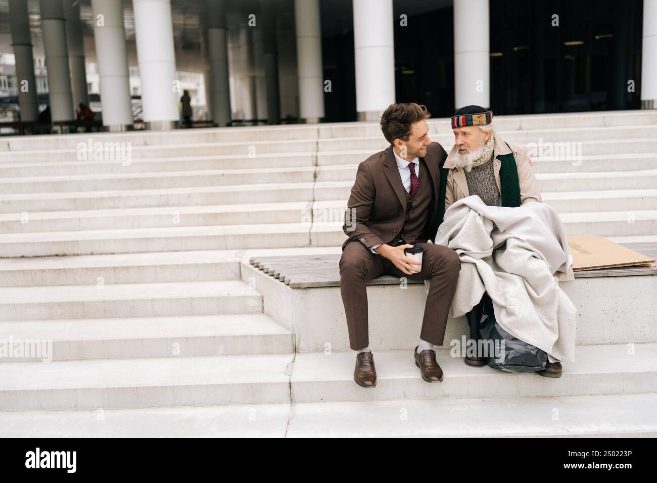 Kindness smiling businessman listening and smiling as talking with ...