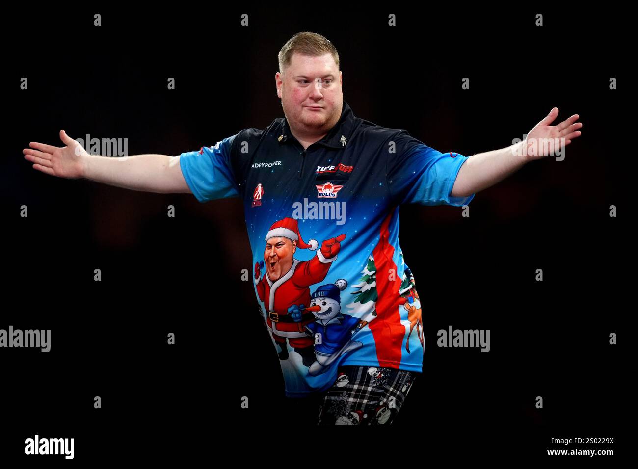 Ricky Evans reacts during his match against Dave Chisnall during day ...