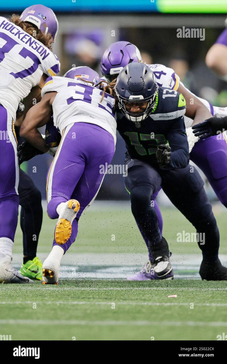 Minnesota Vikings running back Aaron Jones (33) is hit by Seattle ...