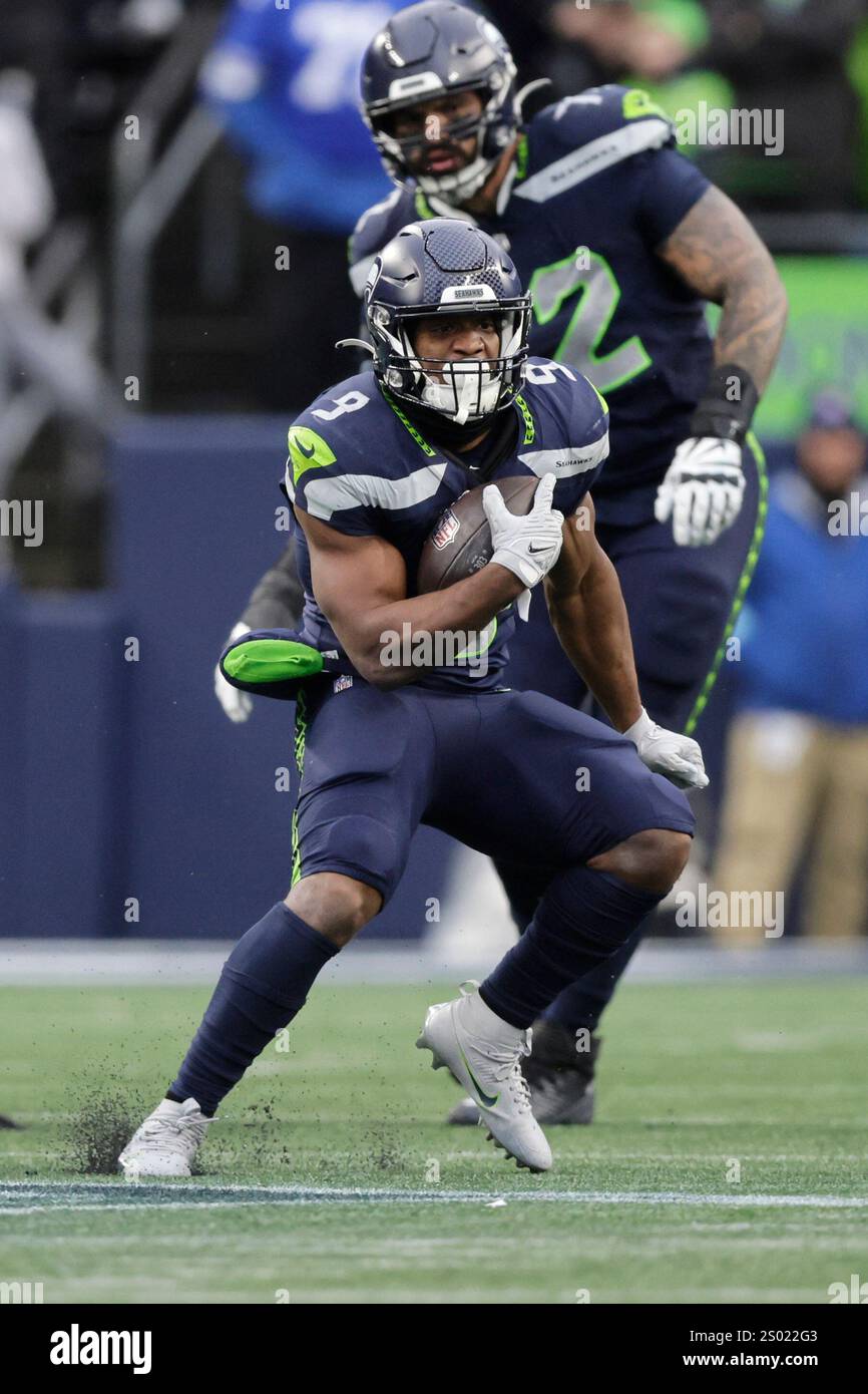 Seattle Seahawks running back Kenneth Walker III (9) carries the ball against the Minnesota ...