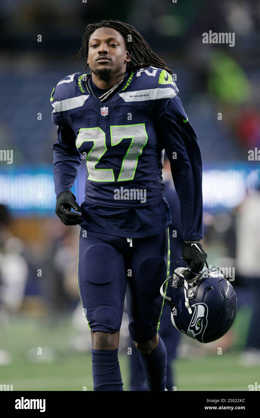 Seattle Seahawks cornerback Riq Woolen (27) runs off the field with his ...
