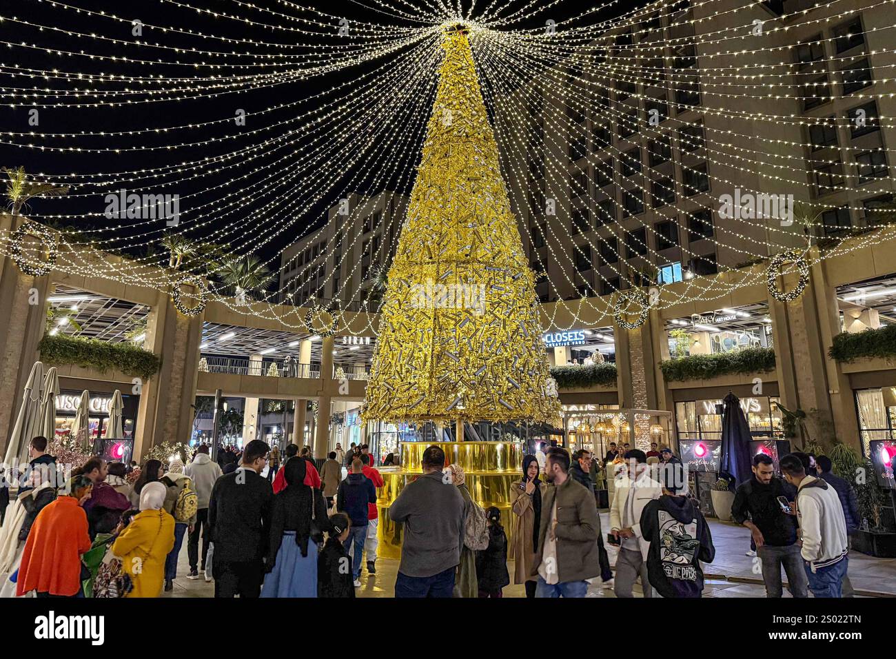 Cairo, Egypt. 23rd Dec, 2024. People are seen around a festive ...