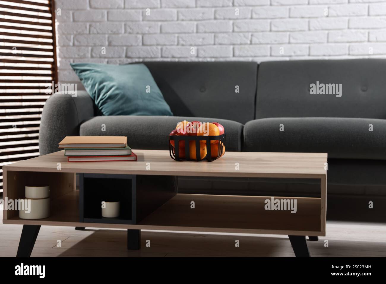 Comfortable sofa and coffee table in living room. Interior design Stock ...