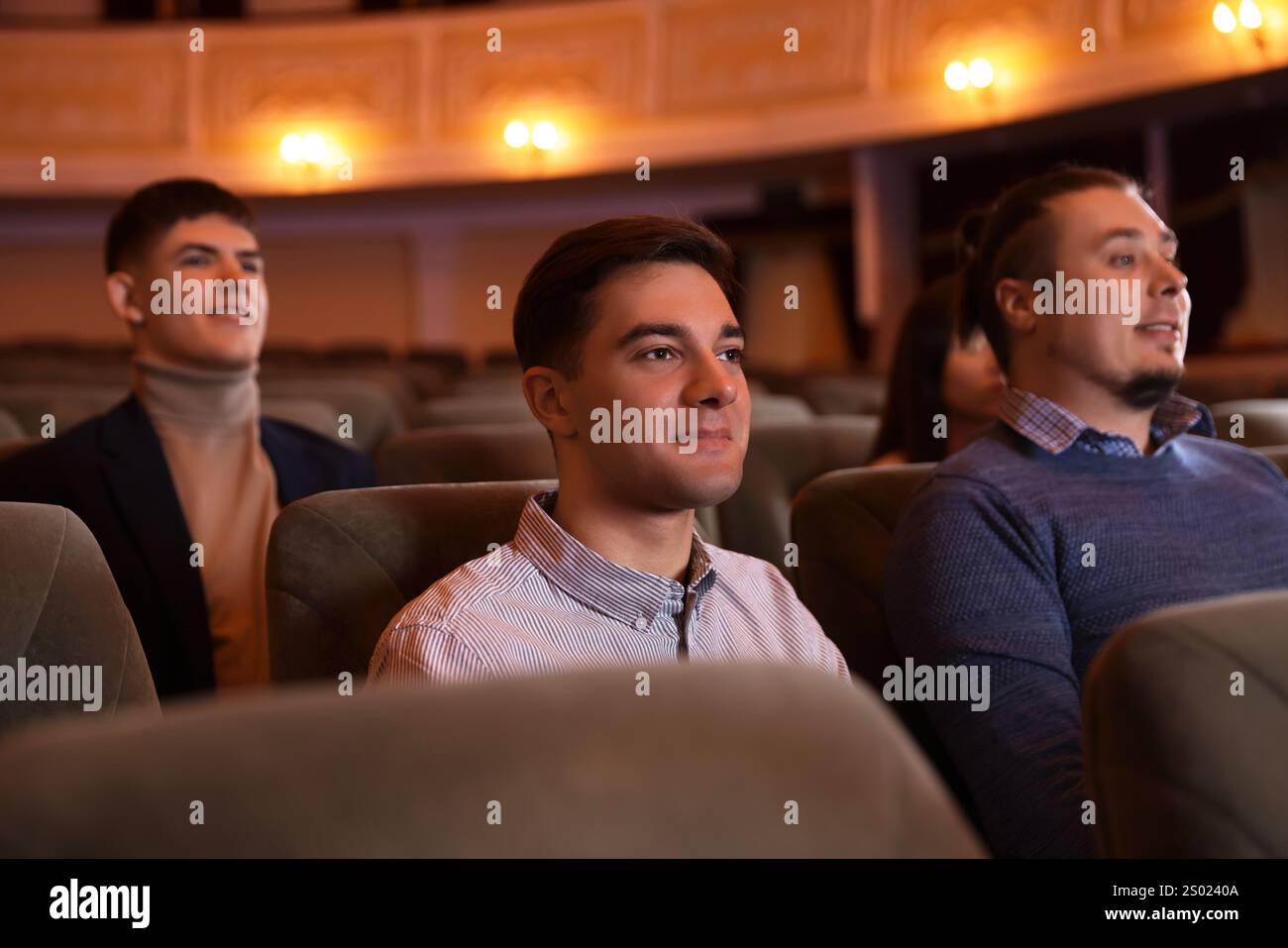 Group of people watching theatrical performance in theatre Stock Photo ...