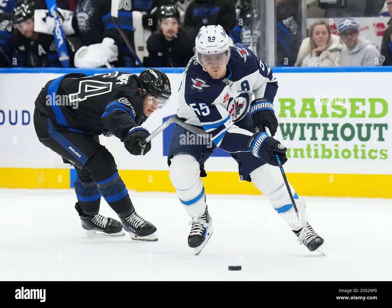 Winnipeg Jets forward Mark Scheifele (55) drives past Toronto Maple ...