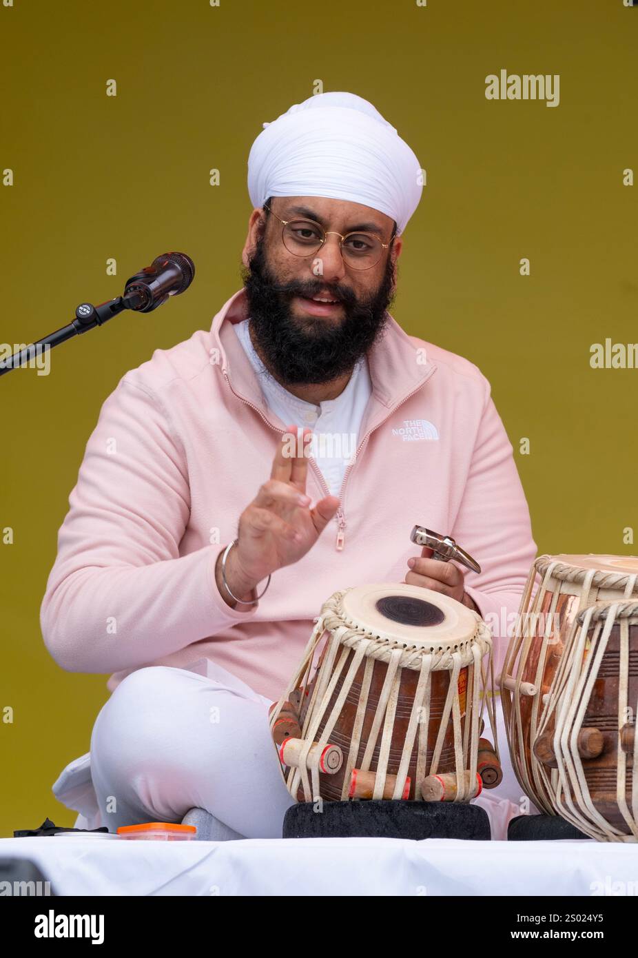Sikh musician performing on the tabla at the Vaisakhi Festival in ...