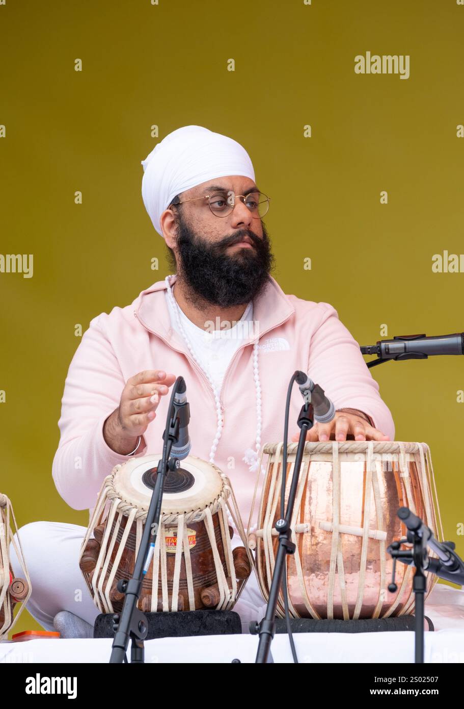Sikh musician performing on the tabla at the Vaisakhi Festival in ...