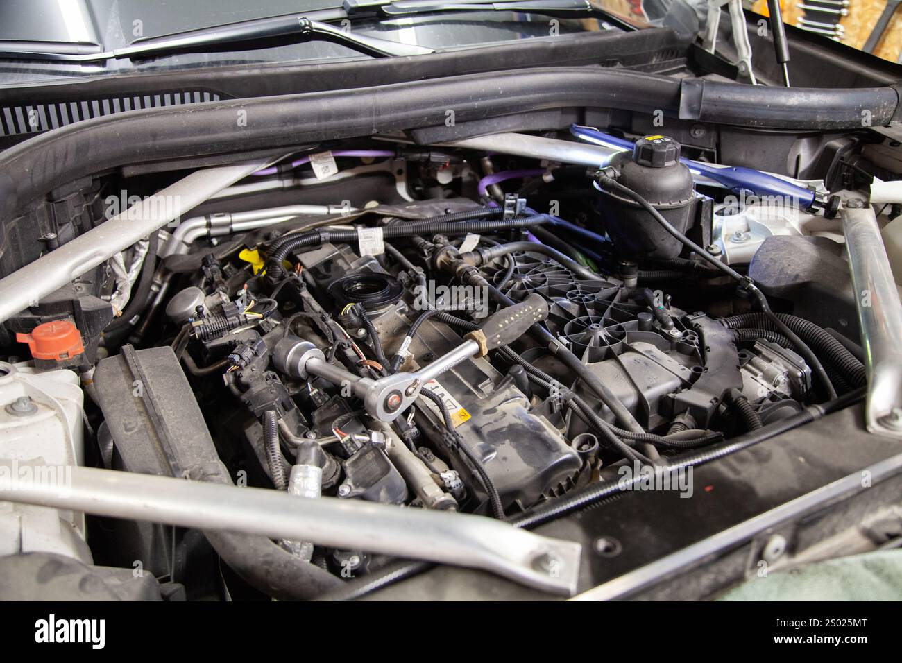 View of the engine without a cover under the hood of a BMW Stock Photo ...