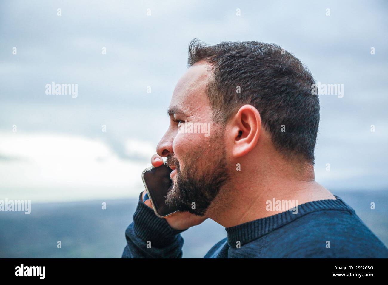 Man Nods Enthusiastically While On the Phone Stock Photo - Alamy