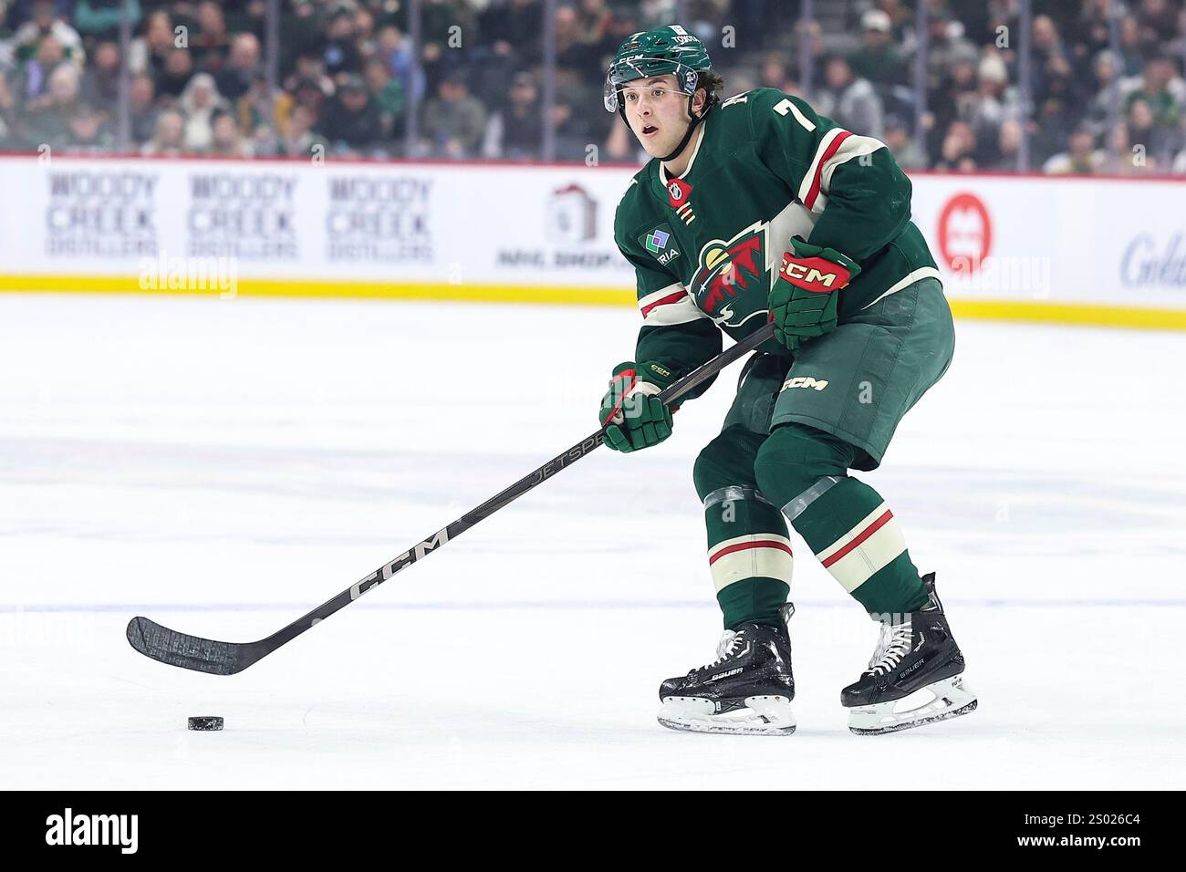 Minnesota Wild defenseman Brock Faber (7) skates with the puck during ...