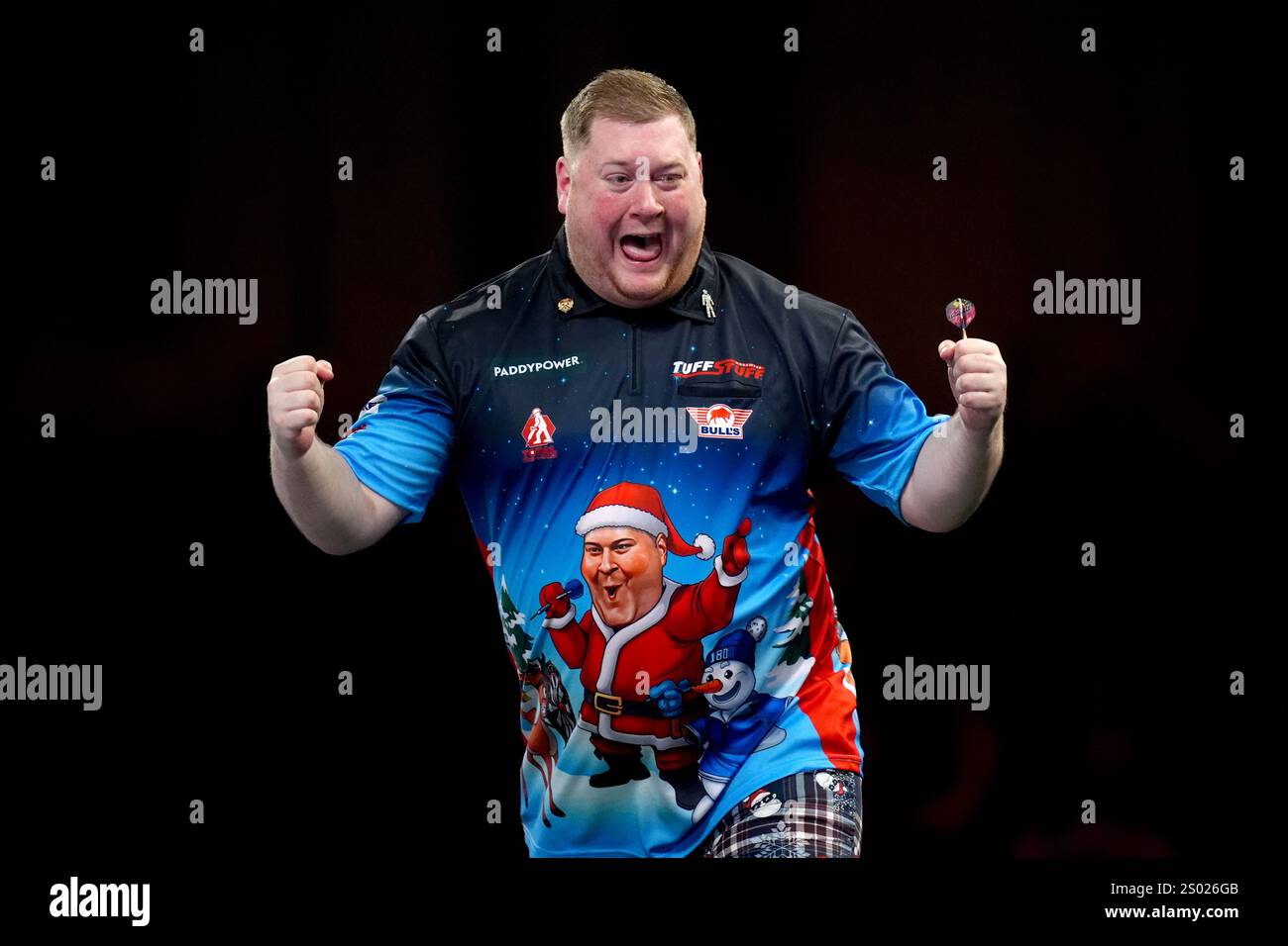 Ricky Evans celebrates defeating Dave Chisnall during day nine of the ...