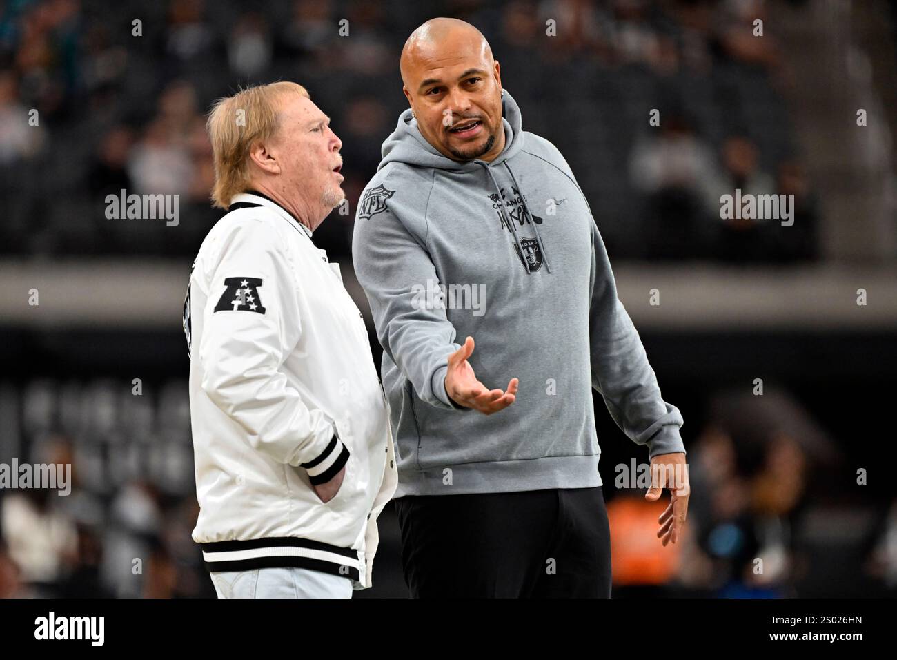 Las Vegas Raiders owner Mark Davis, left, and head coach Antonio Pierce ...
