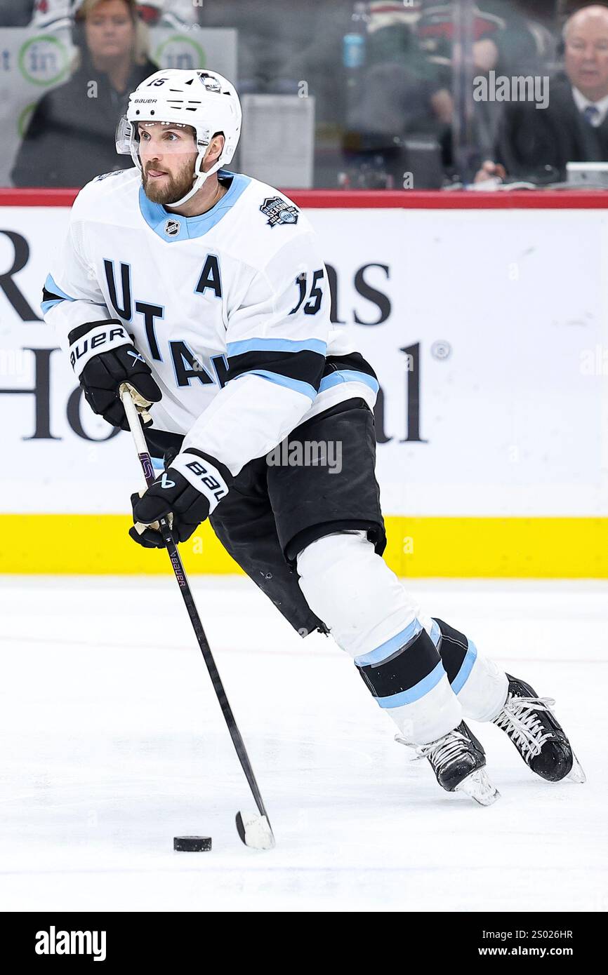 Utah Hockey Club center Alexander Kerfoot (15) skates with the puck ...