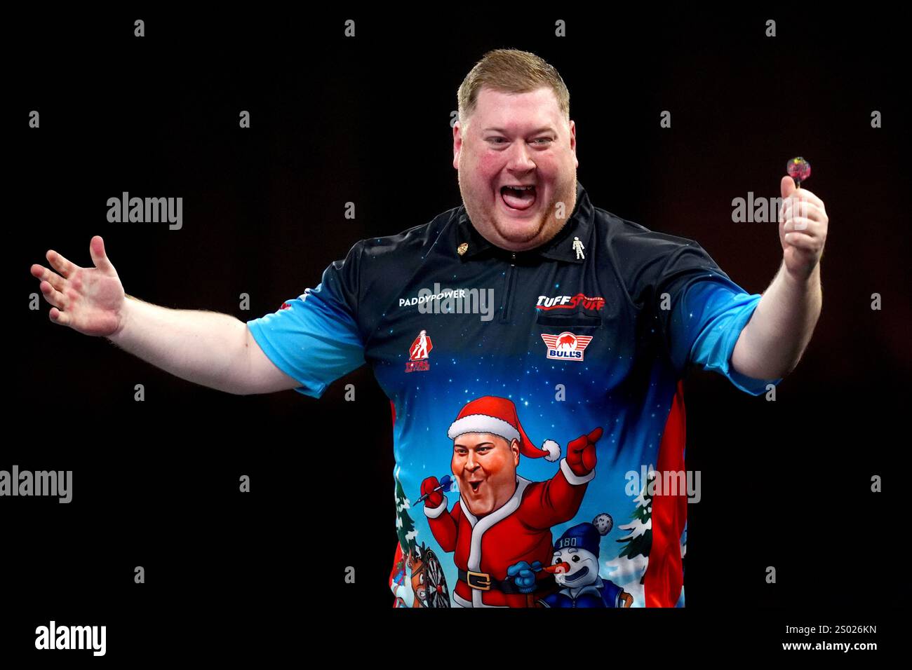 Ricky Evans celebrates defeating Dave Chisnall during day nine of the ...