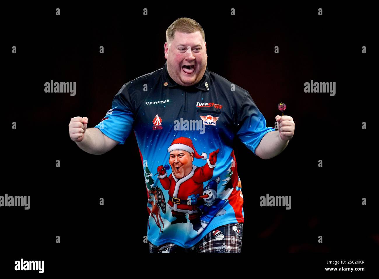 Ricky Evans celebrates defeating Dave Chisnall during day nine of the ...