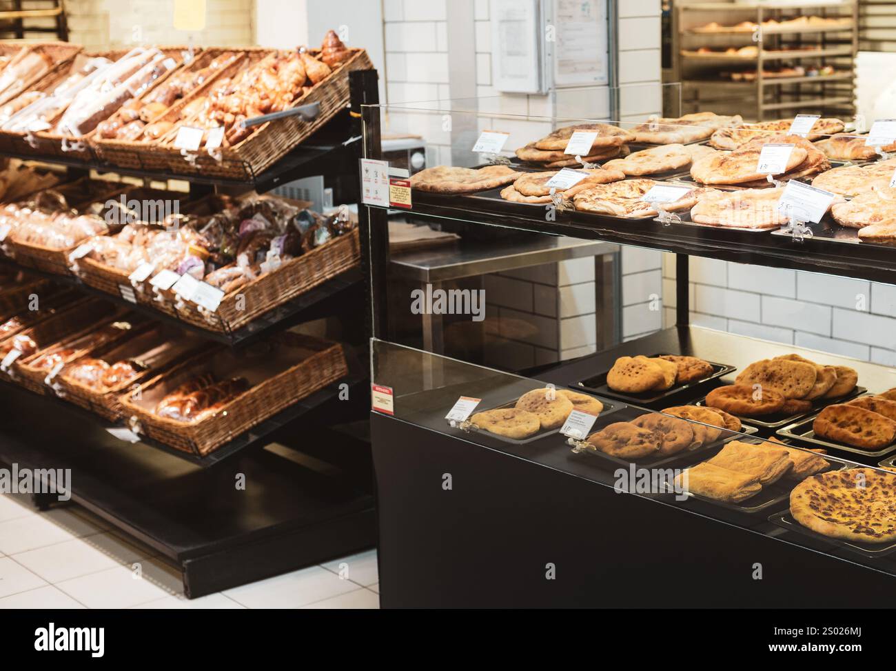 bakery store shelves loaded with pizza and breads Stock Photo - Alamy