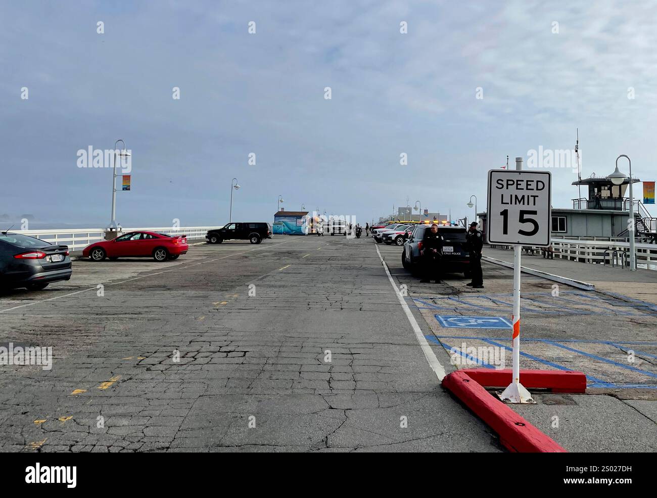 Law enforcement officers close off the Santa Cruz, Calif., wharf Monday ...