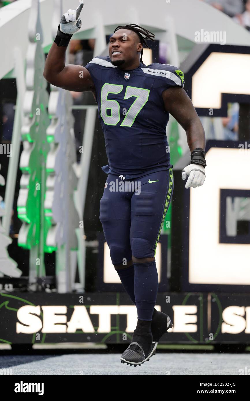 Seattle Seahawks offensive tackle Charles Cross (67) runs onto the ...