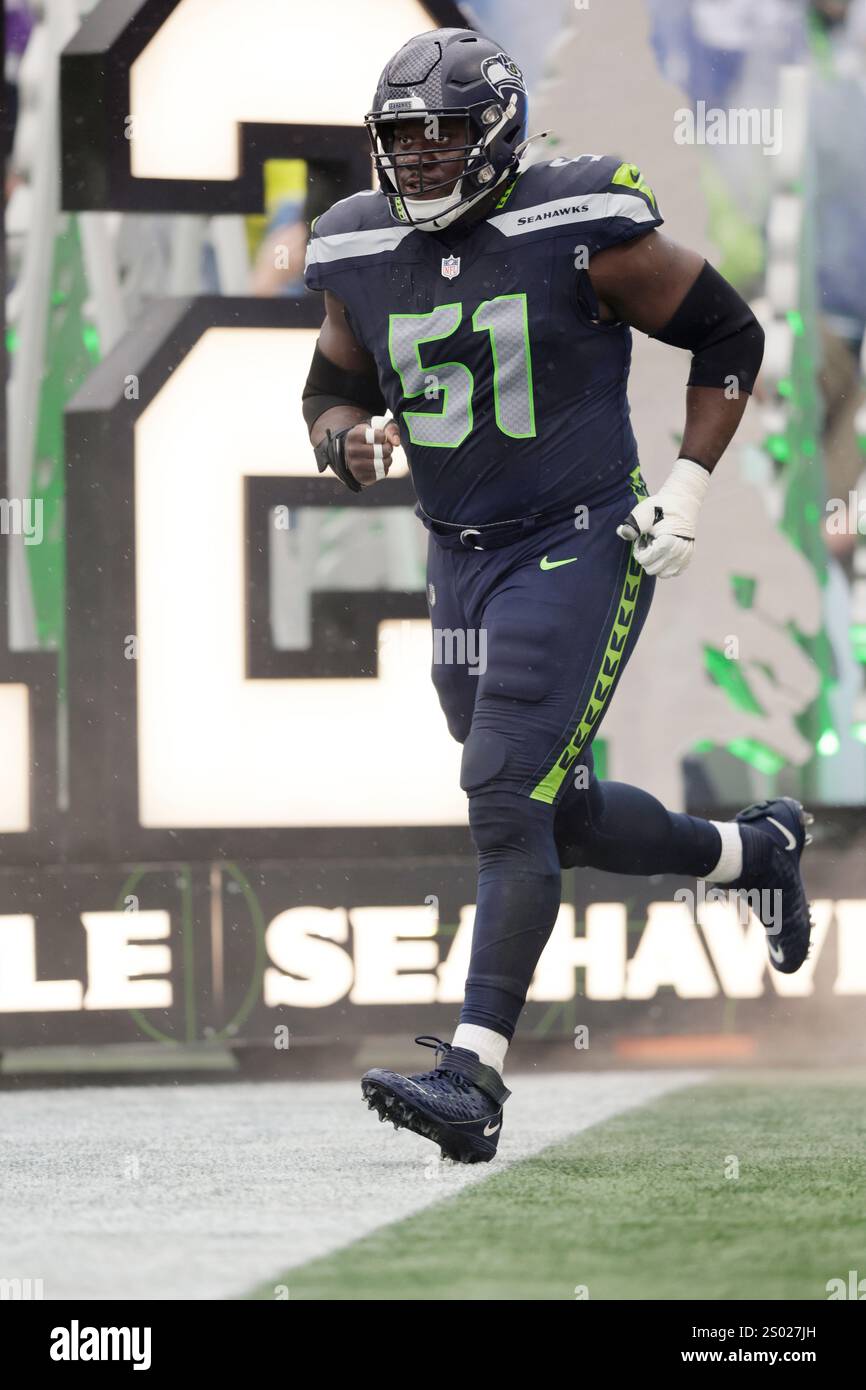 Seattle Seahawks center Olu Oluwatimi (51) runs onto the field during ...
