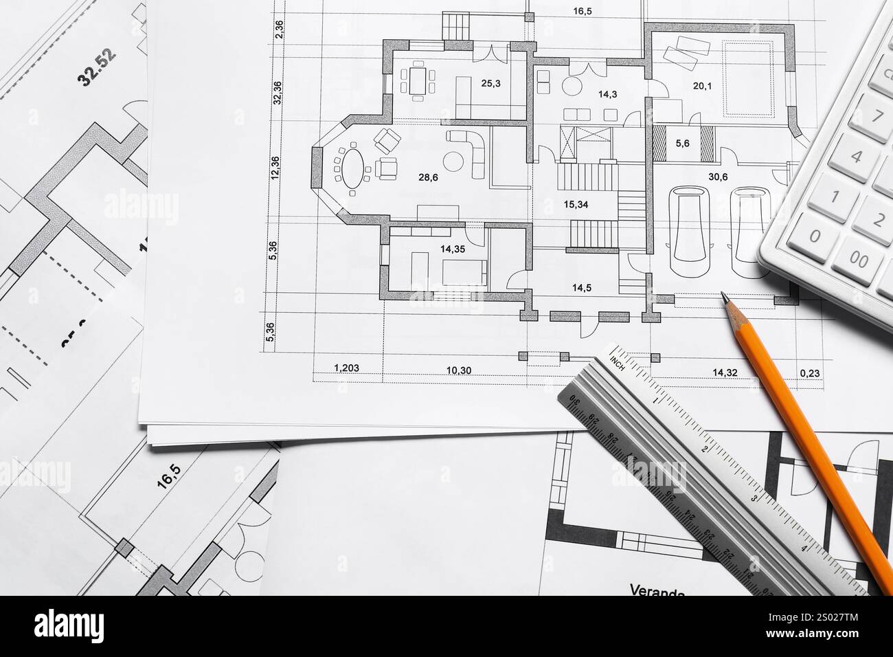 Different architectural drawings, calculator, ruler and pencil, top ...