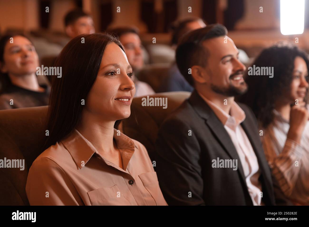 Group of people watching theatrical performance in theatre Stock Photo ...
