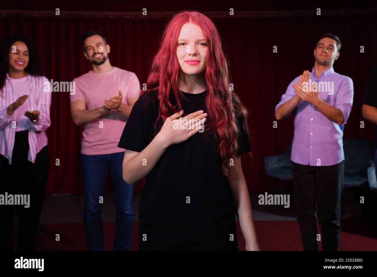 Professional actors bowing on stage in theatre Stock Photo - Alamy