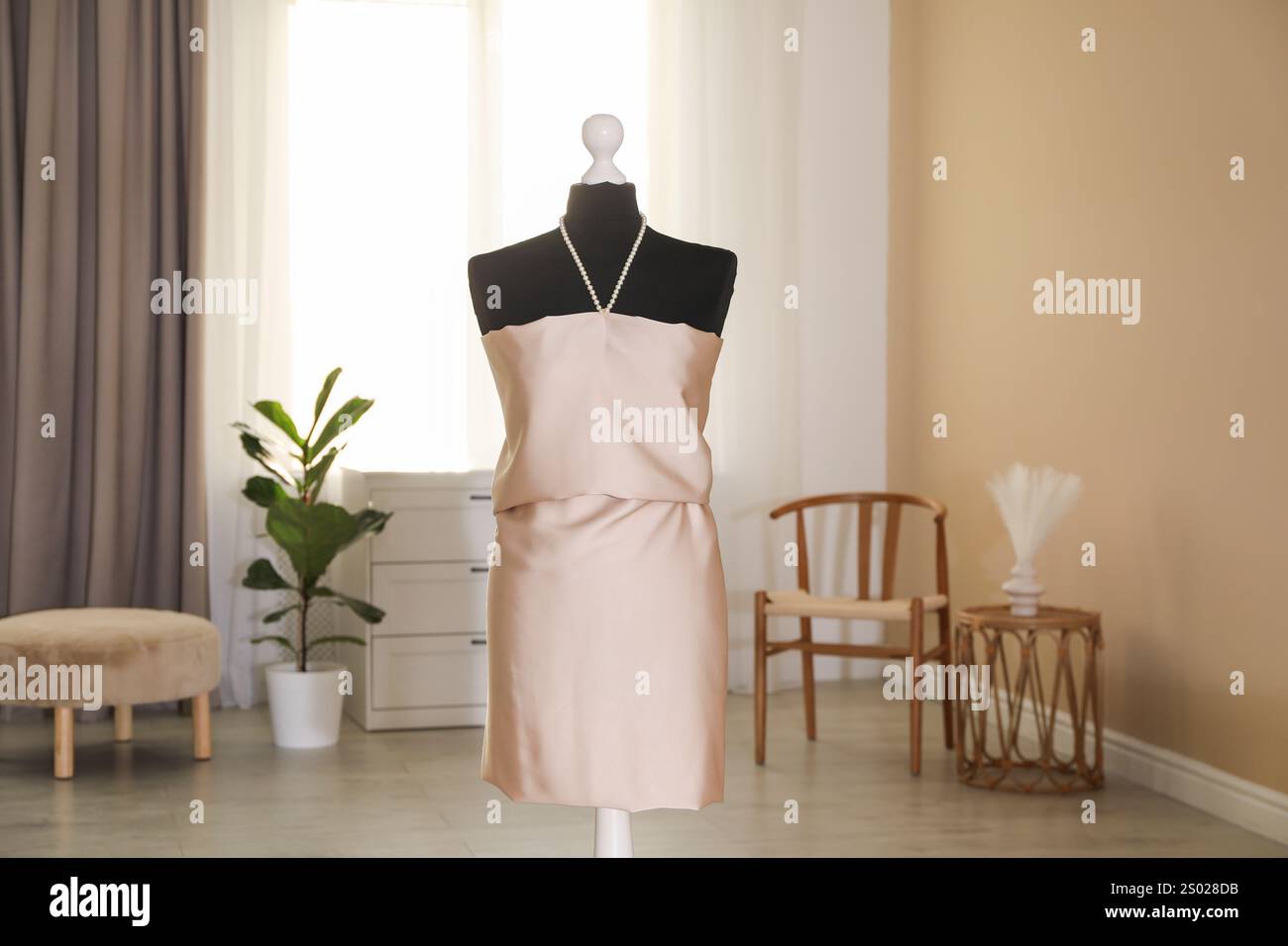 One female mannequin with unfinished dress in workshop Stock Photo - Alamy
