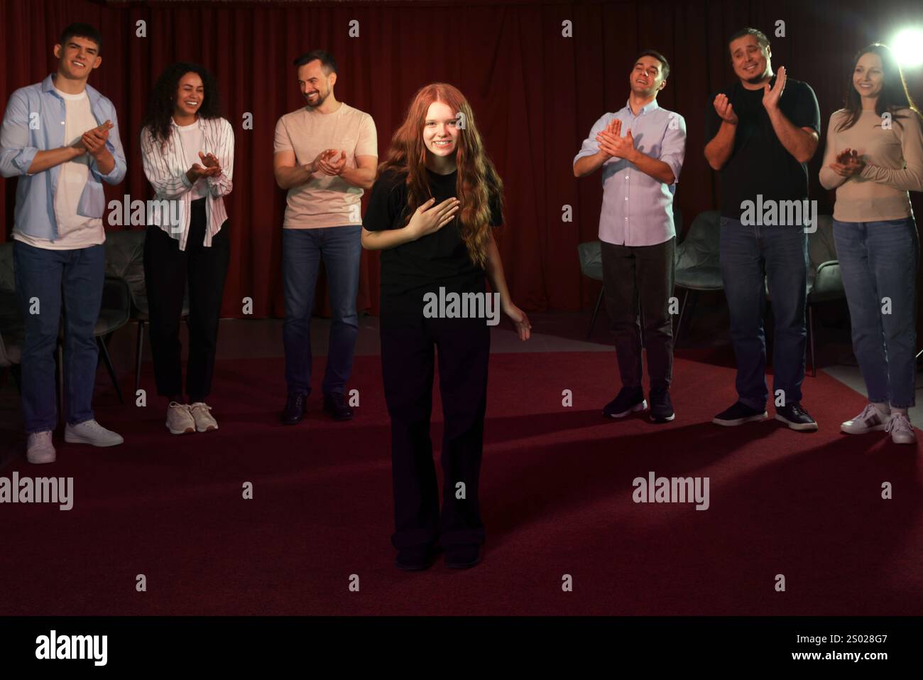 Professional actors bowing on stage in theatre Stock Photo - Alamy