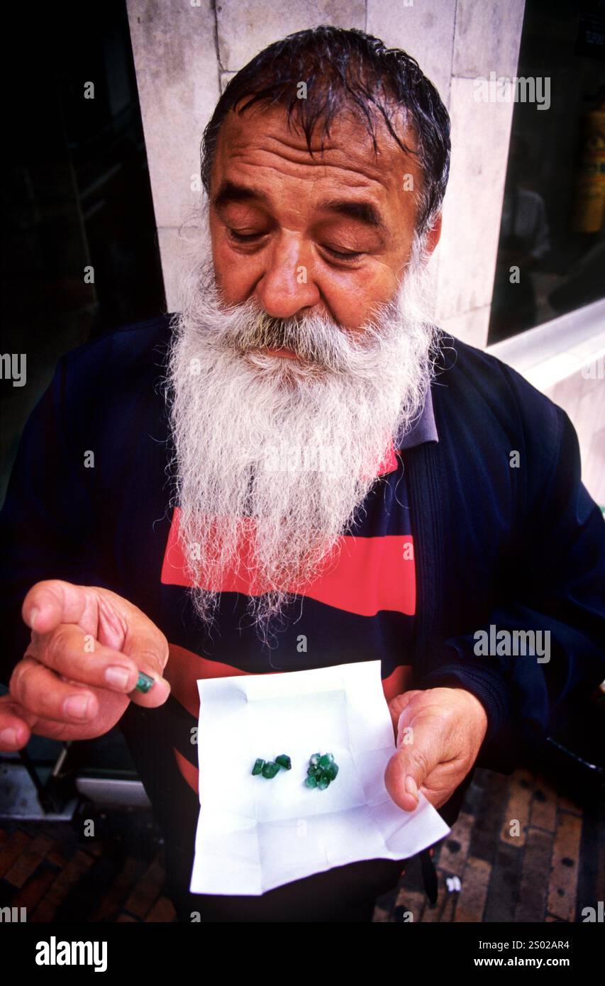 Emerald street vendor displaying raw gems in La Candelaria, Bogotá ...
