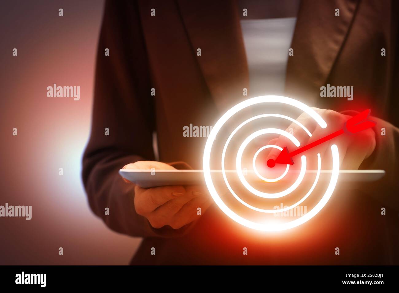 Virtual target with arrow, businesswoman touching tablet on color ...