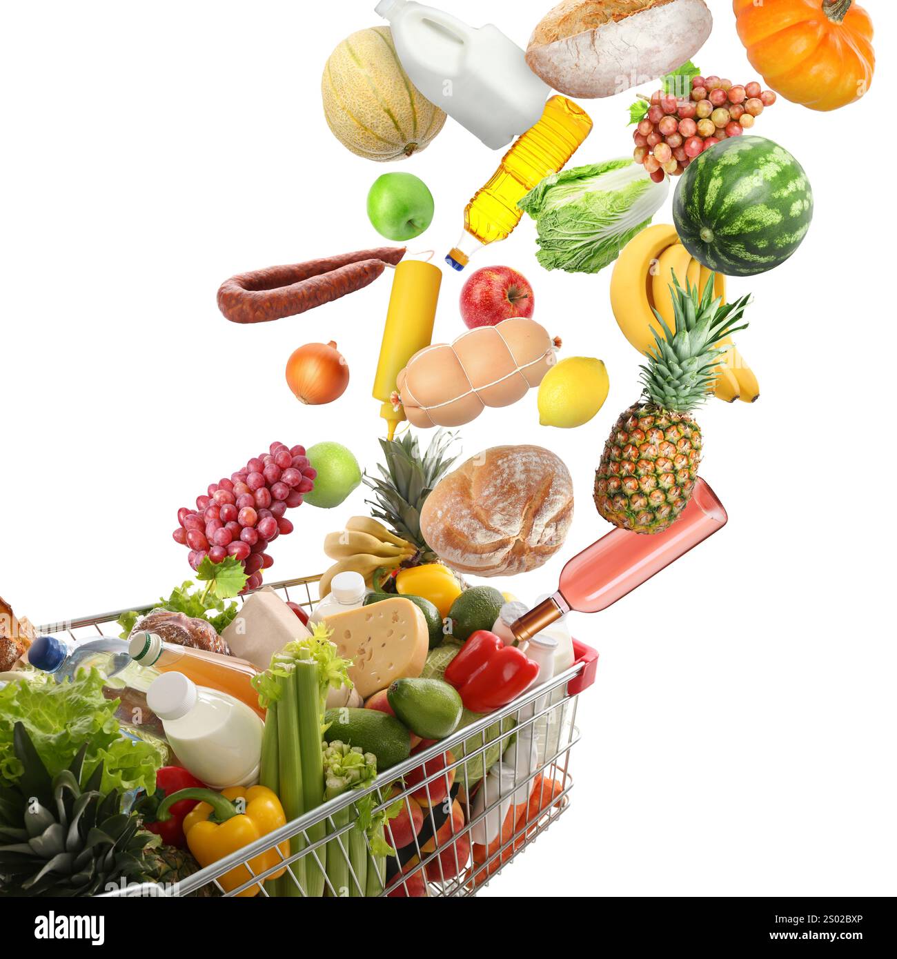 Many different products falling into shopping cart on white background ...