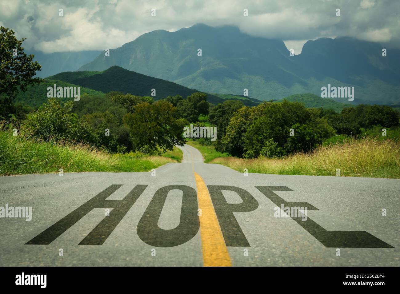 Word Hope on asphalt road leading to mountains Stock Photo - Alamy