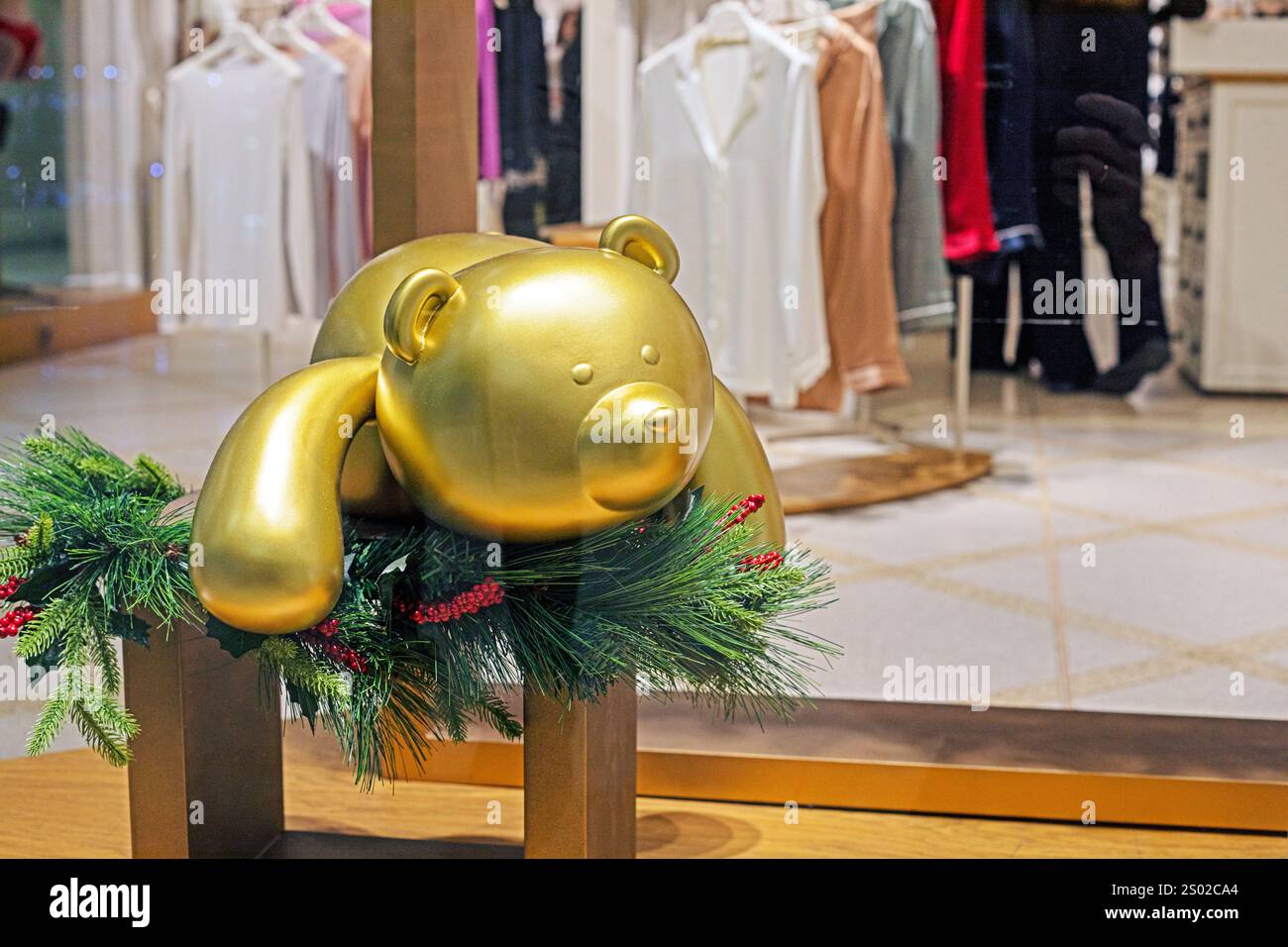 cute figurine of a bronze lying bear in the interior Stock Photo - Alamy