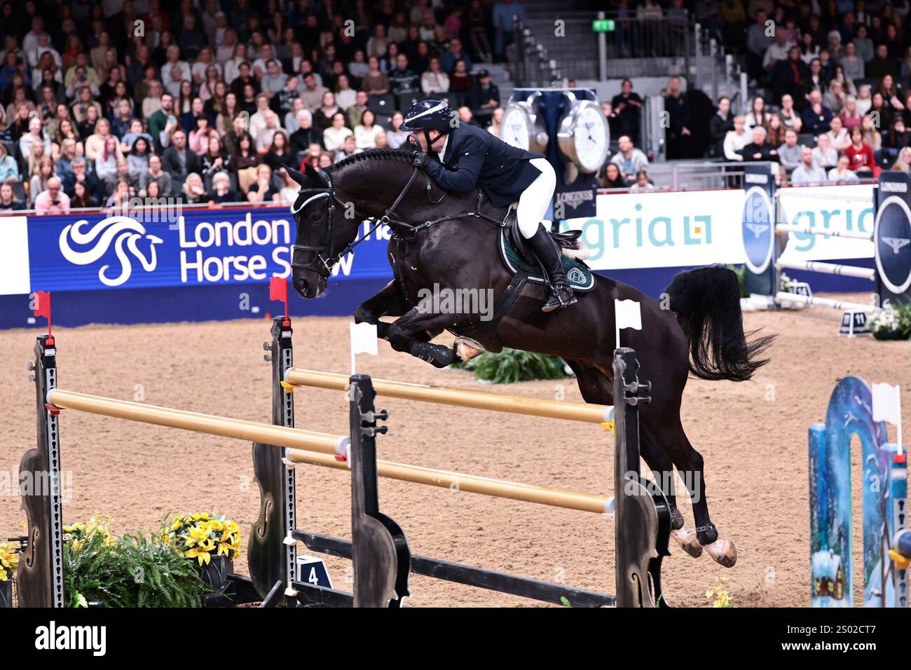Robert Whitaker of United Kingdom with Vermento during the Longines FEI ...