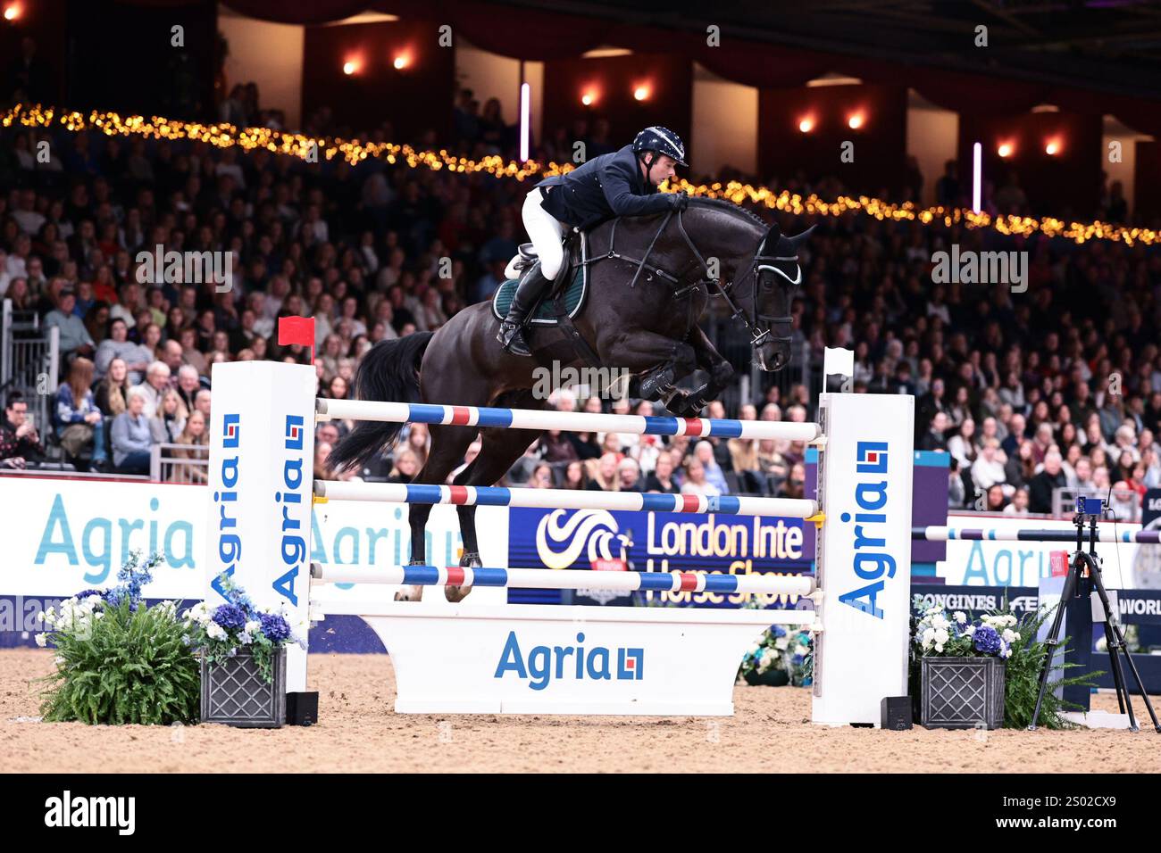 Robert Whitaker of United Kingdom with Vermento during jump-off of the ...