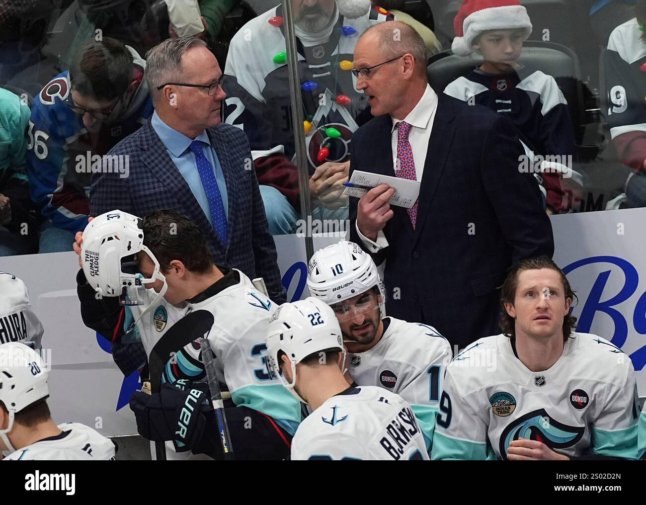 Seattle Kraken head coach Dan Bylsma, right, confers with assistant ...