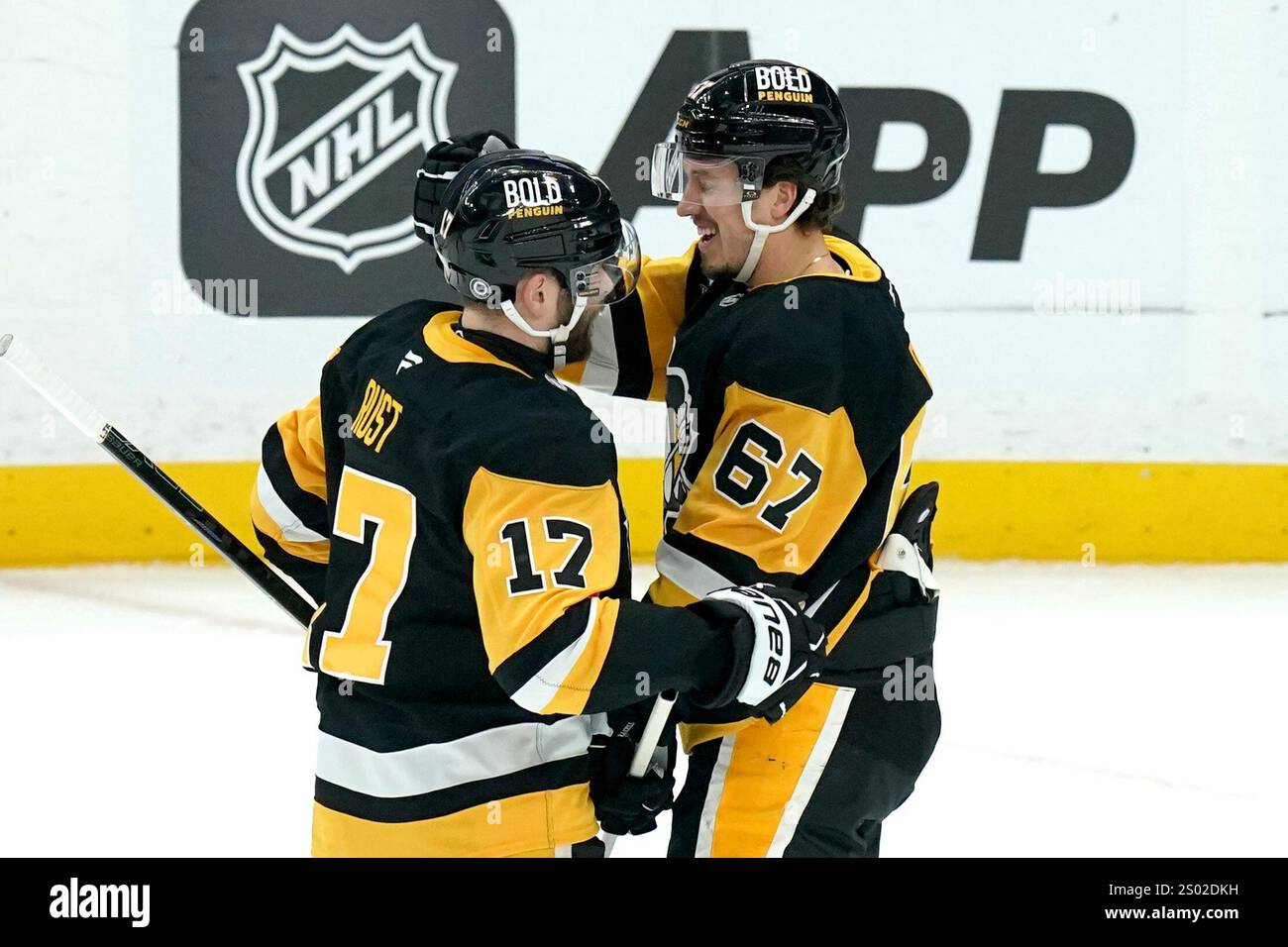 Pittsburgh Penguins' Rickard Rakell (67) celebrates with Bryan Rust (17 ...