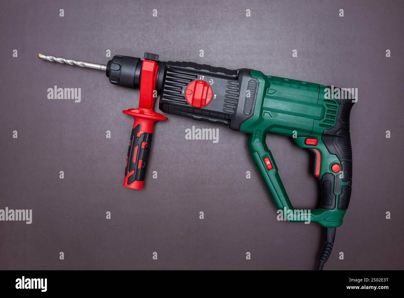 Hammer drill with handle on a working table Stock Photo - Alamy